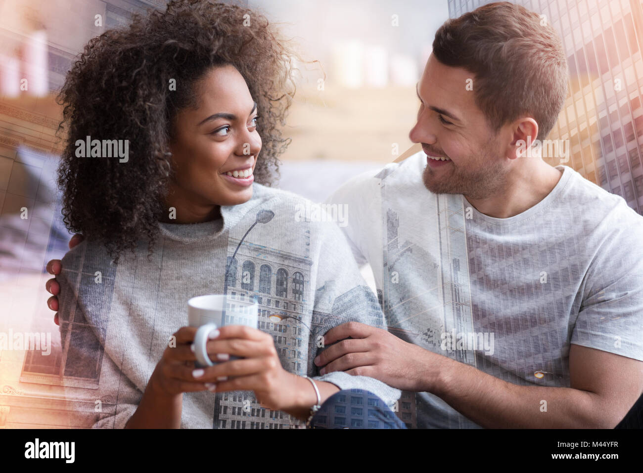 Positive happy couple looking at each other Stock Photo - Alamy