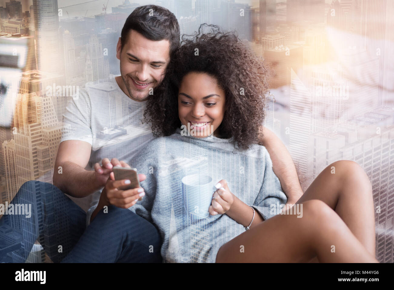Nice happy man pointing at the smartphone screen Stock Photo - Alamy