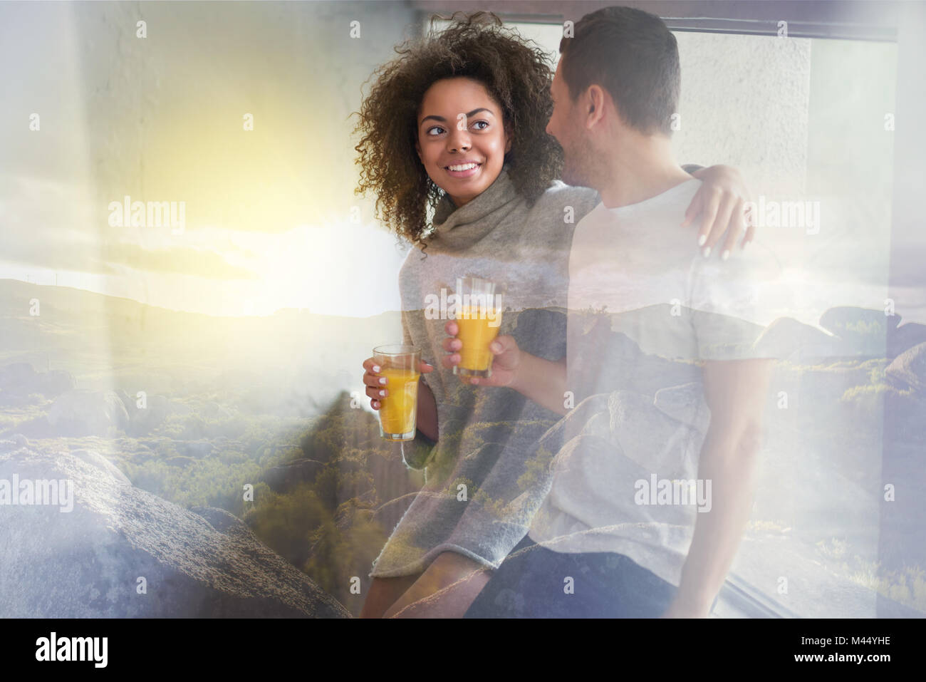 Attractive young woman hugging her boyfriend Stock Photo - Alamy