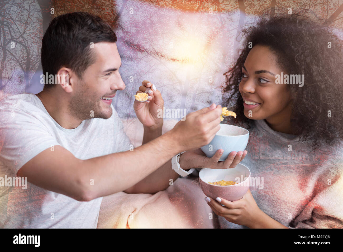 Couple feeding each other food hi-res stock photography and images - Alamy