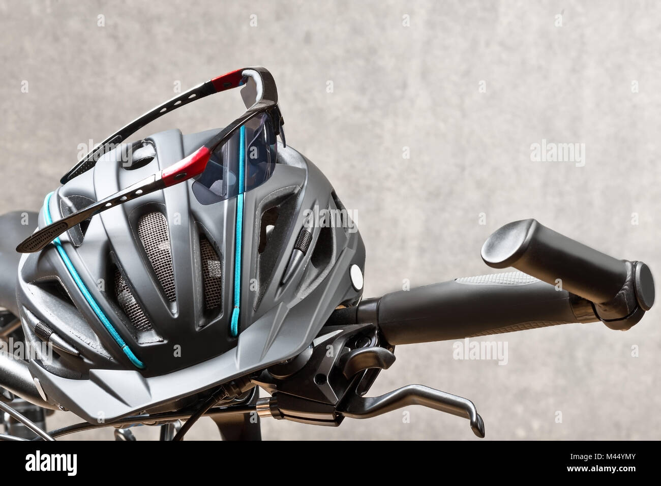 Detail Of Handlebars With Sunglasses And Safety Helmet Stock Photo - Alamy