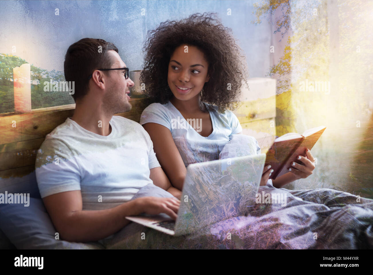 Handsome positive man looking at his girlfriend Stock Photo - Alamy