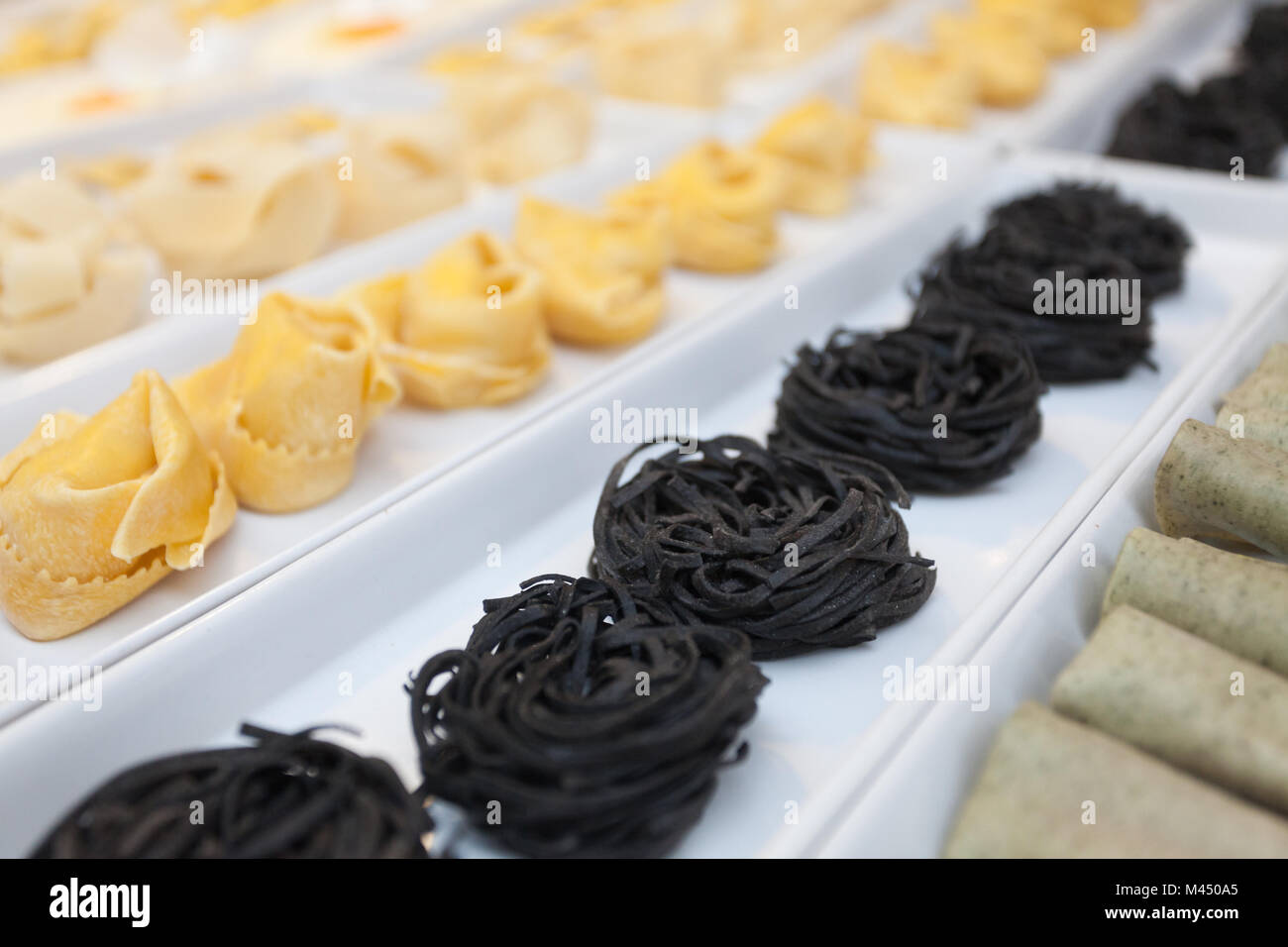 Different types of eggs pasta in a street food, Greece Stock Photo - Alamy