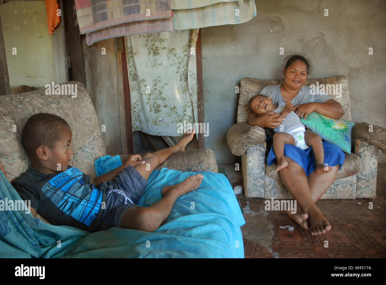 A mum and her 2 young children at home, Rakiraki, Fiji Stock Photo - Alamy