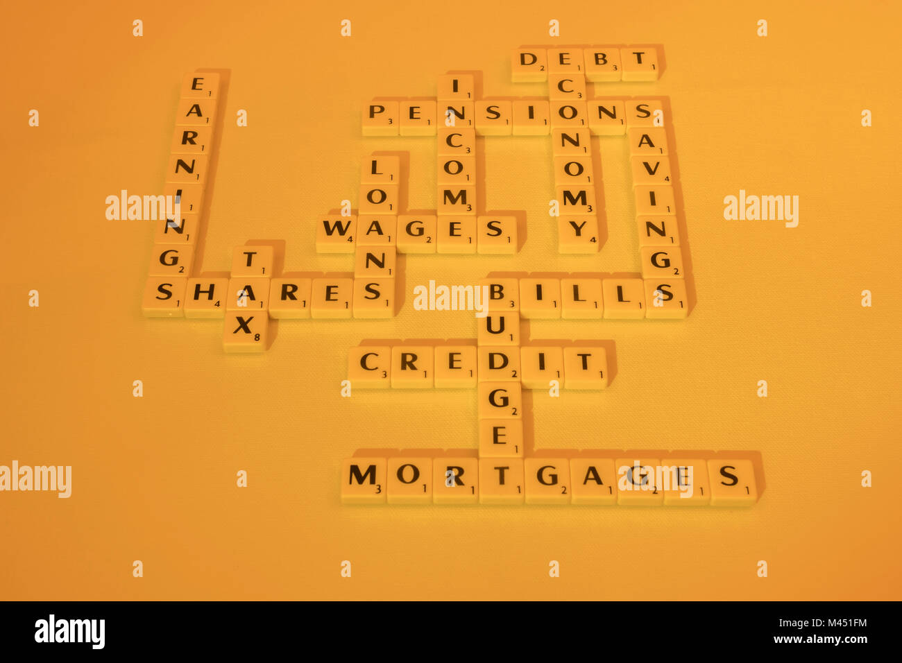 Alphabet tiles forming financial instruments, financial system, money ...