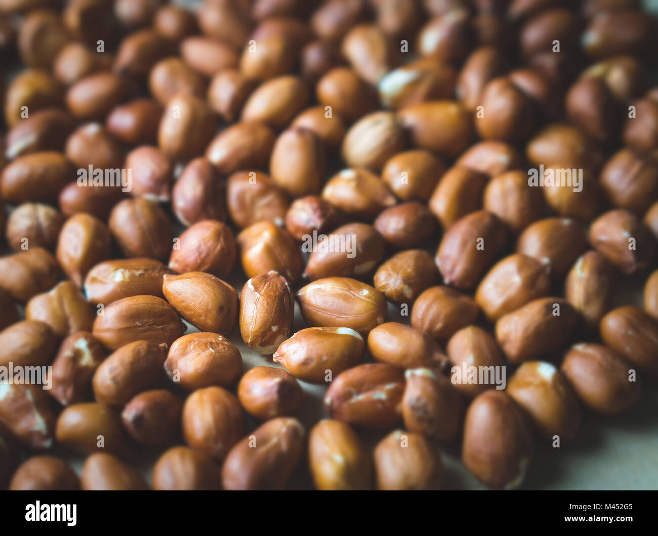 Close up to many peanuts. Bunch of nuts. Group of groundnuts. Shallow ...