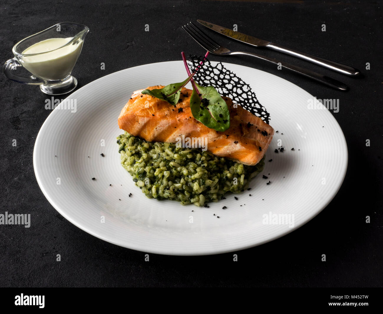 Salmon steak on spinach risotto hi-res stock photography and images - Alamy