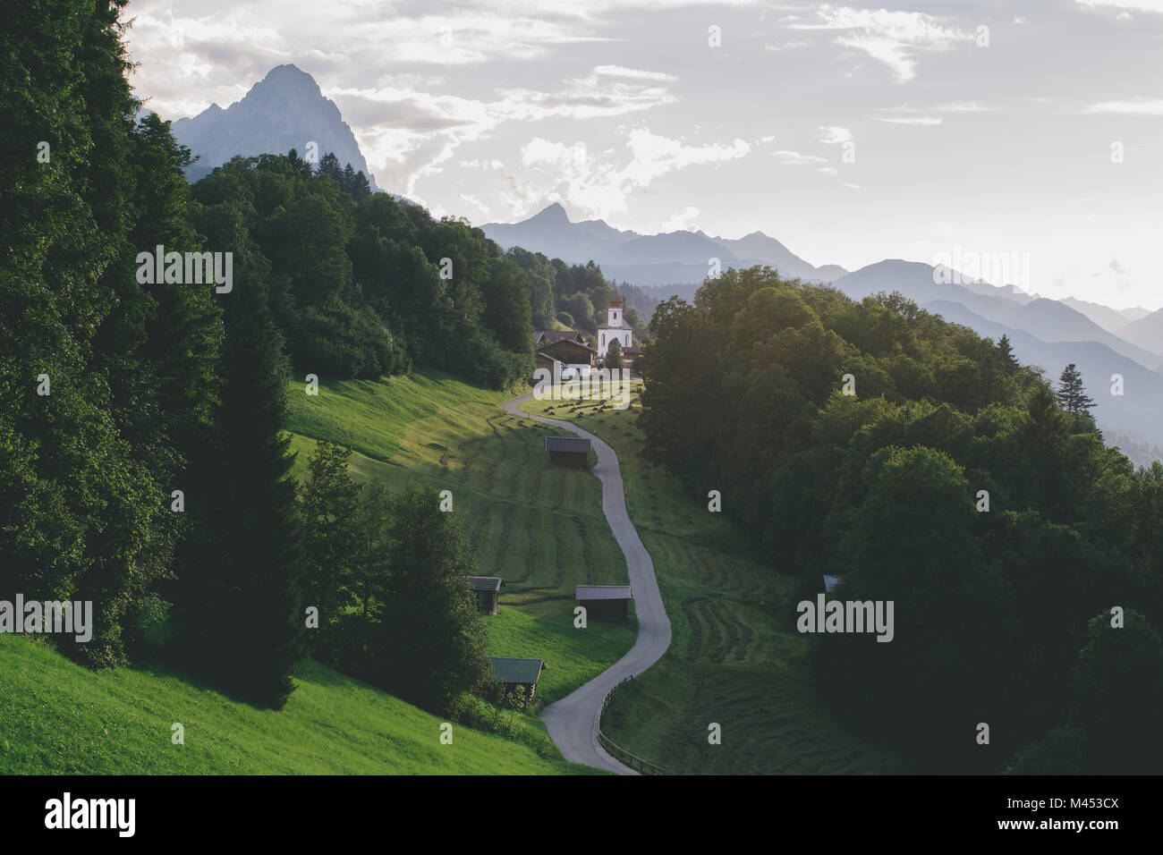 The iconic Wamberg Church, with Mount Alpspitze and Zugspitze on the ...