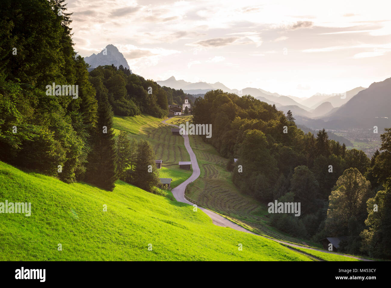 The iconic Wamberg Church, with Mount Alpspitze and Zugspitze on the ...