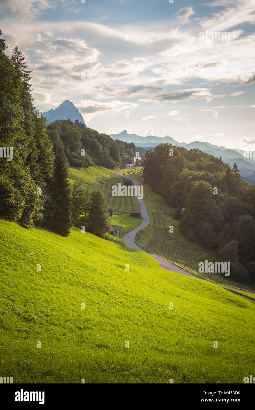 The iconic Wamberg Church, with Mount Alpspitze and Zugspitze on the ...