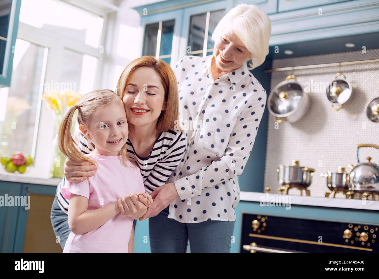 Three generations of women bonding in the kitchen Stock Photo - Alamy