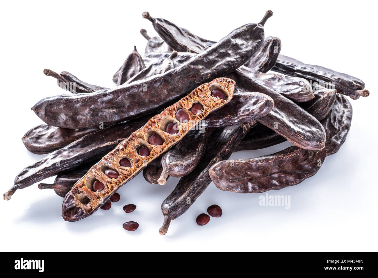 Dried carob fruit close up Cut Out Stock Images & Pictures - Alamy