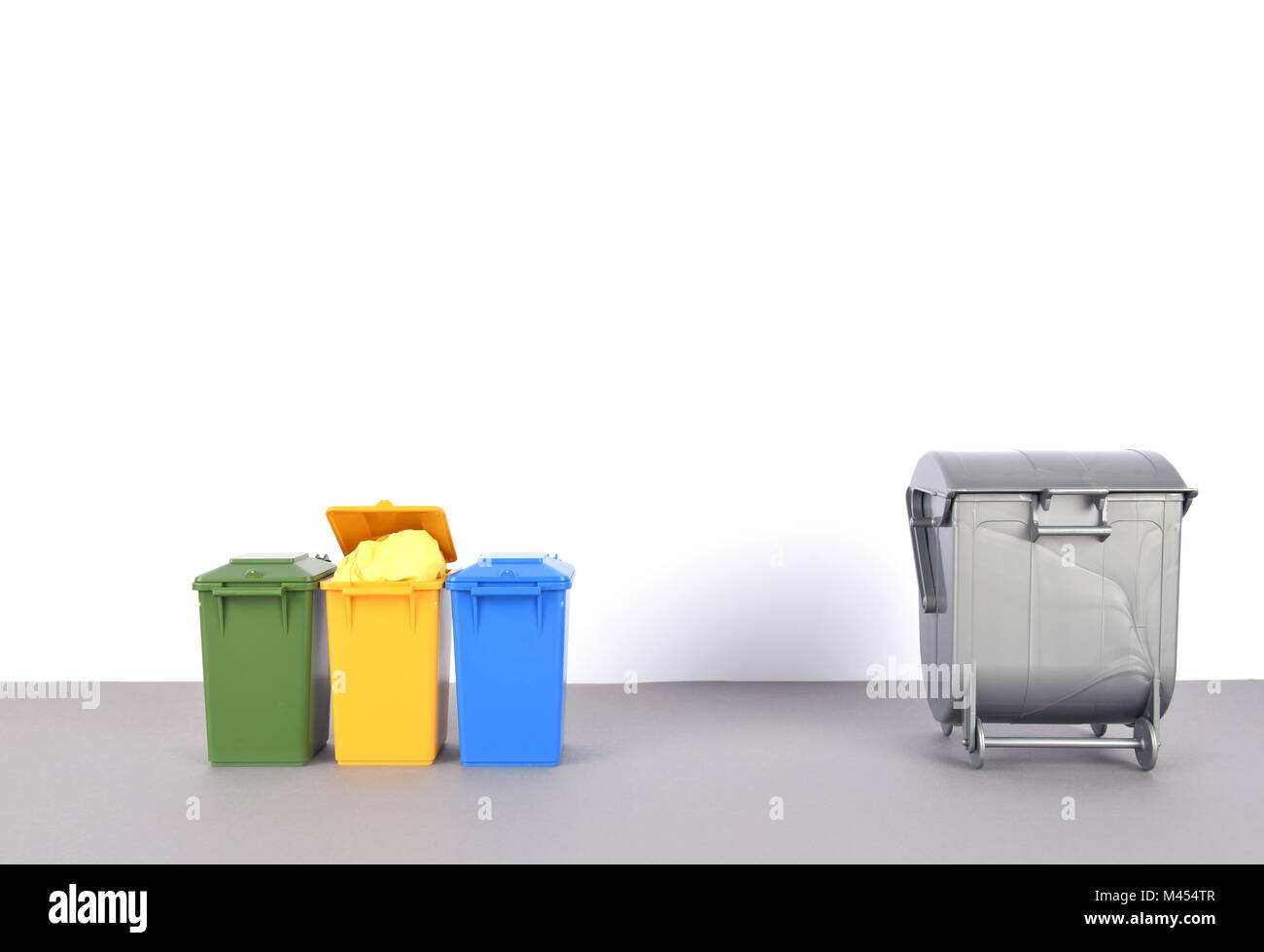 Colorful recycle bins on white background Stock Photo - Alamy