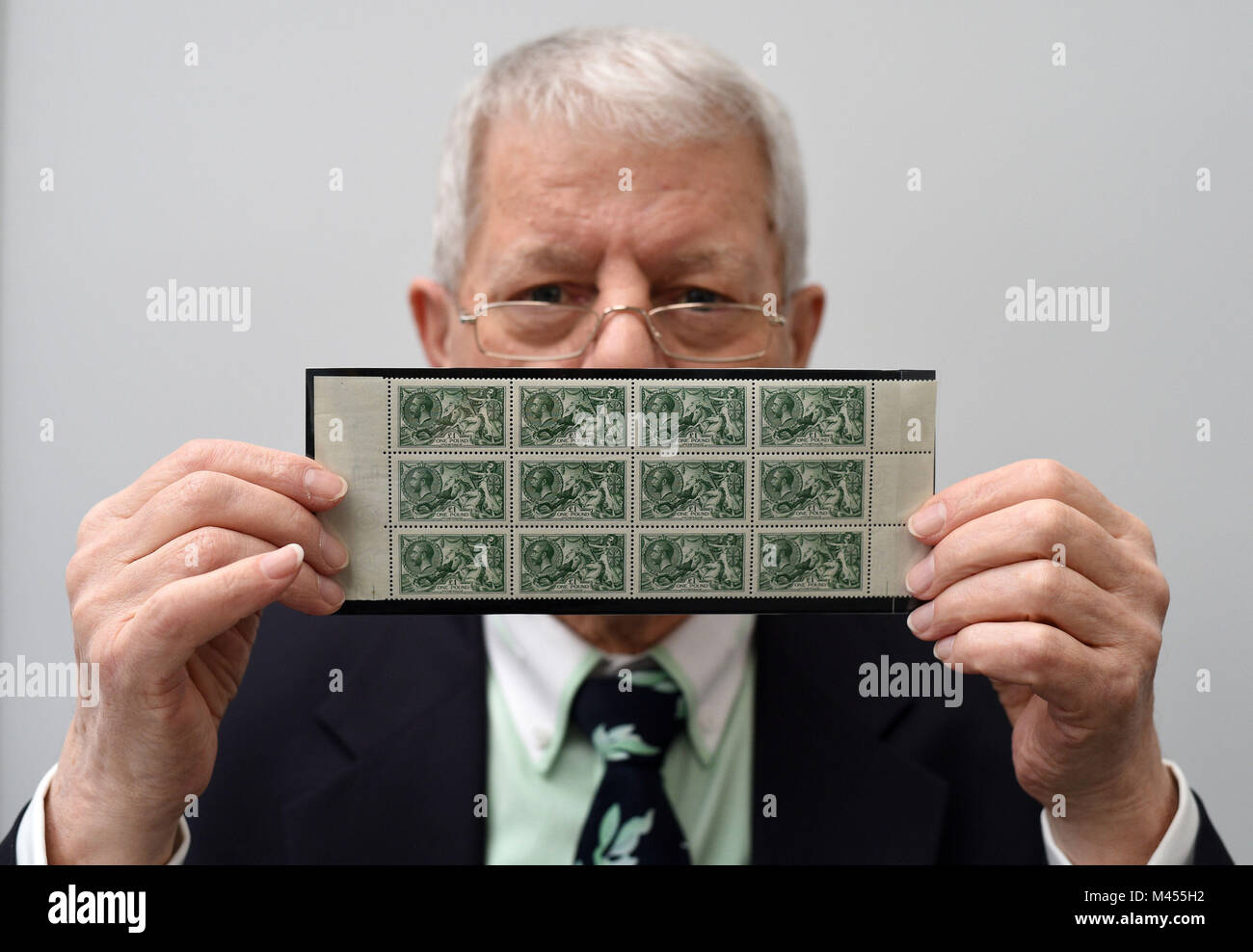 Stamp dealer Michael Chipperfield holds a collection of twelve S.G 403 ...