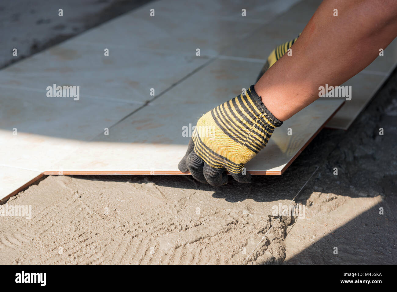 Installing tiles hi-res stock photography and images - Alamy
