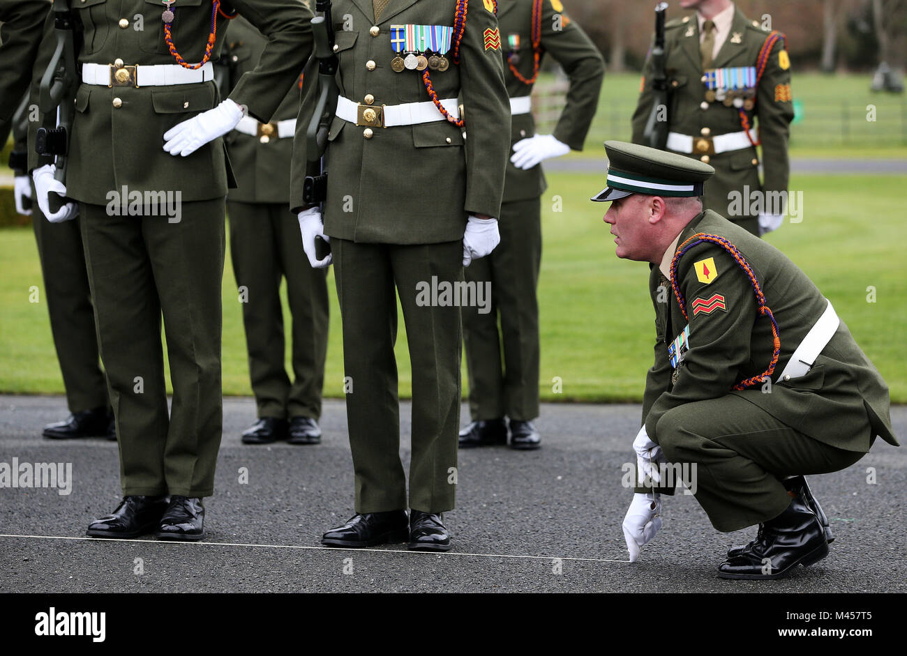 Members of the defence forces prepare a guard of honour at Aras an ...
