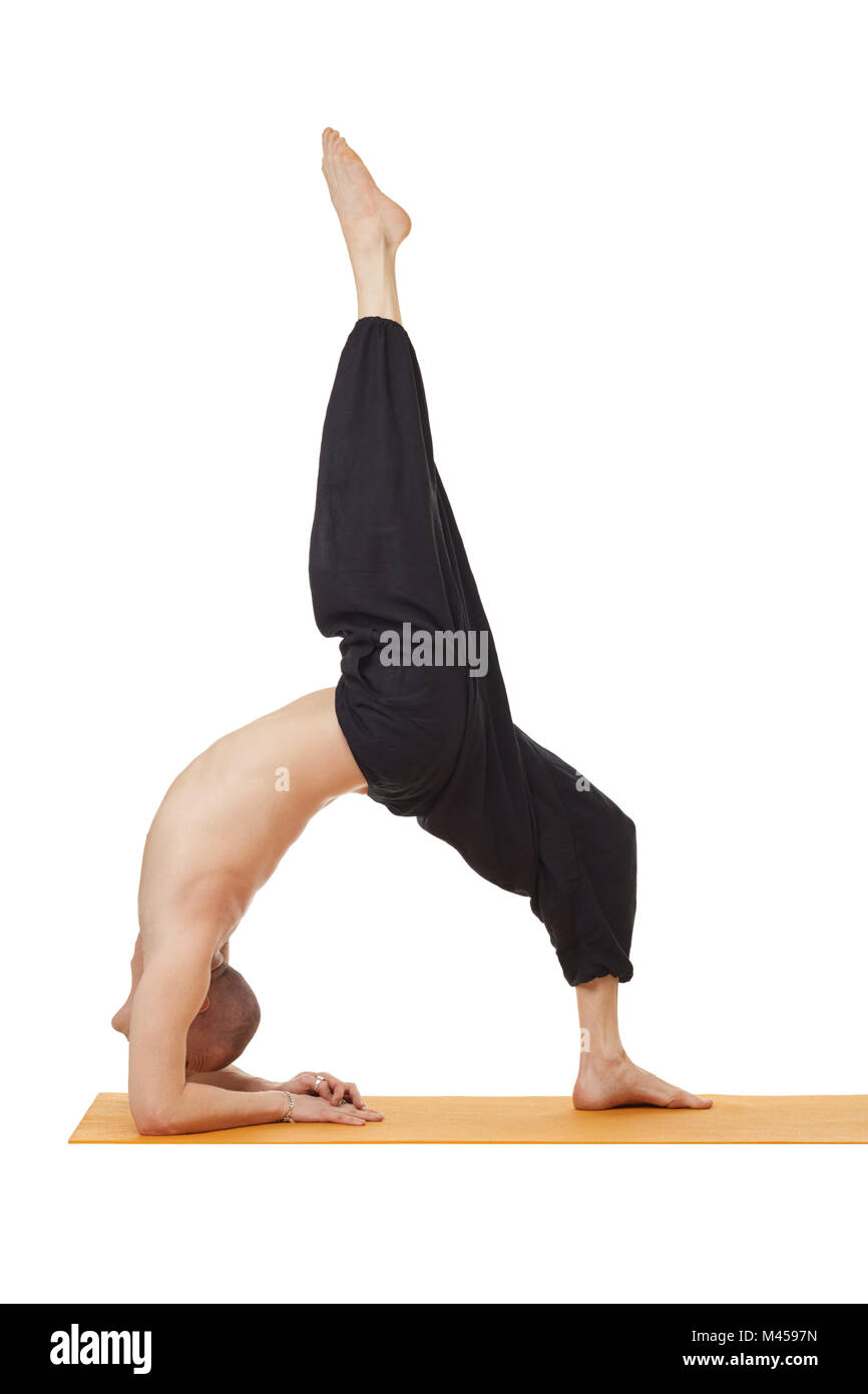 Yoga exercise. Instructor posing in difficult pose Stock Photo - Alamy