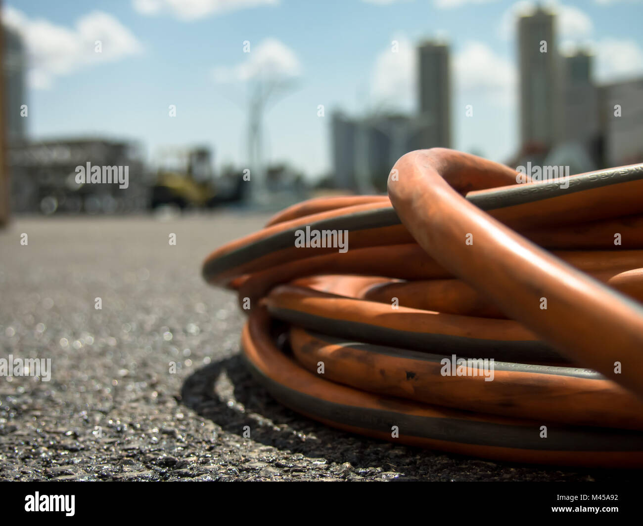 The Orange Extension Cord on the Ground at the Constructionsite Stock ...