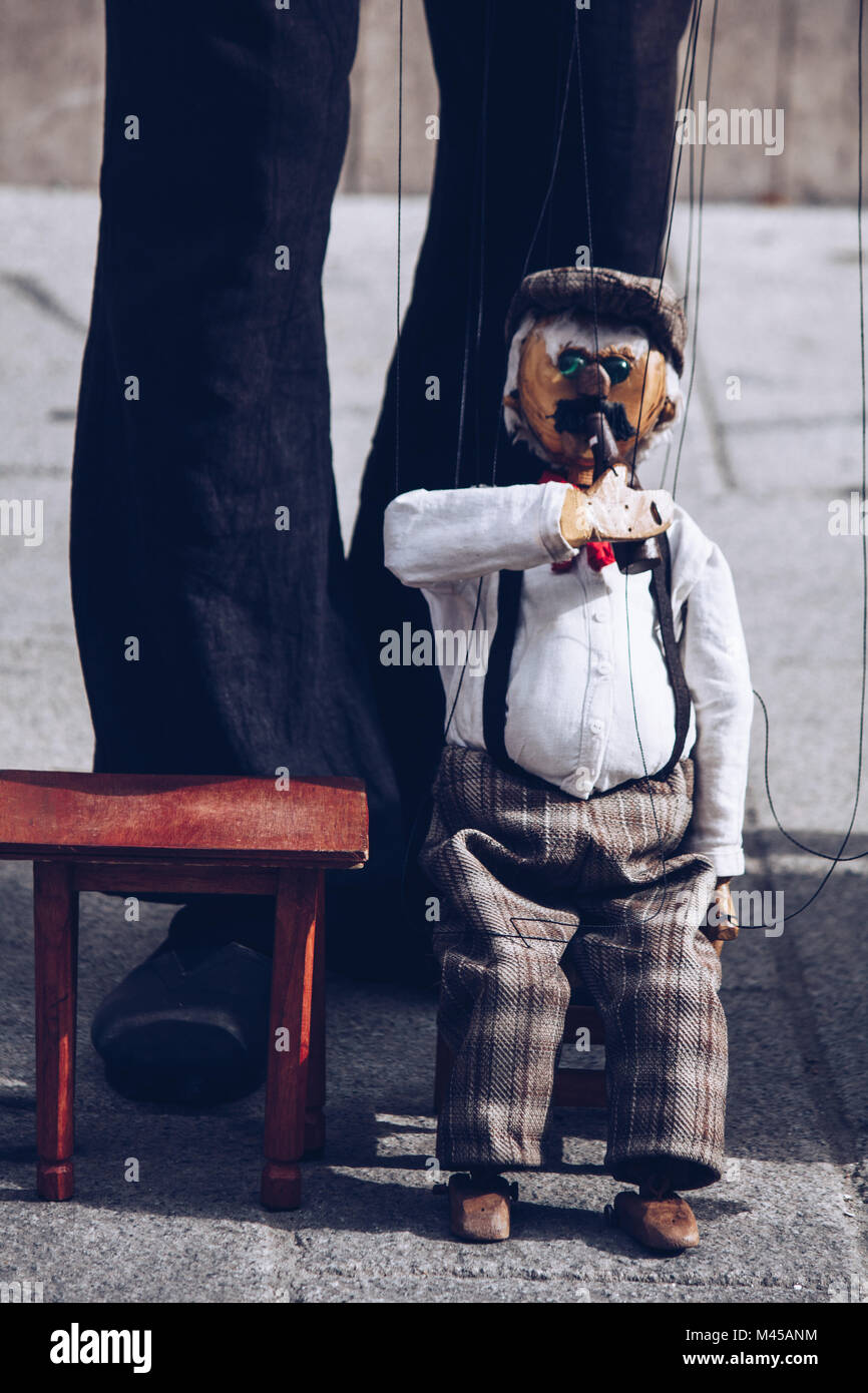 funny handicraft puppets drinking beer street art Stock Photo - Alamy