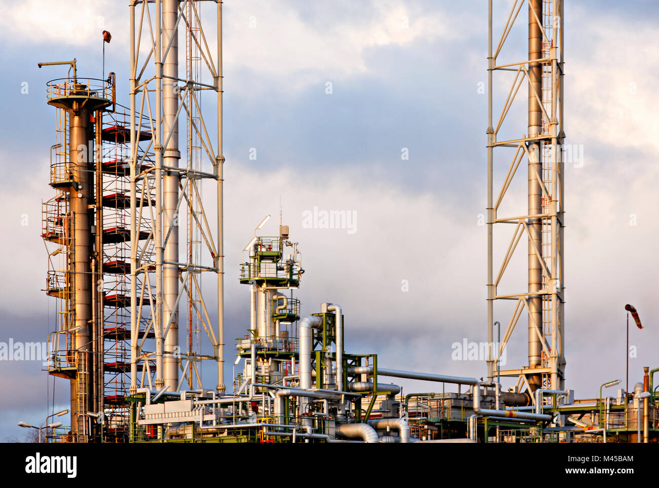 An old oil refinery with flare stacks Stock Photo - Alamy