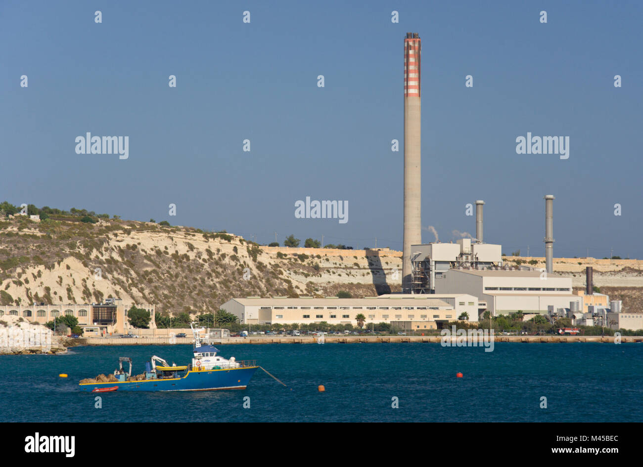 An oil power station in mediterranean landscape by the sea, Malta Stock ...
