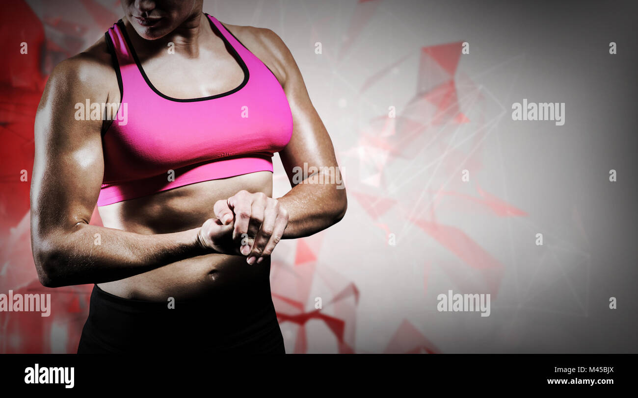 Composite image of muscular woman flexing her arm Stock Photo - Alamy