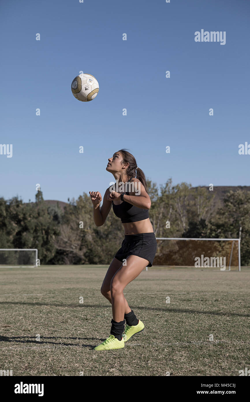 Woman playing football hi-res stock photography and images - Alamy