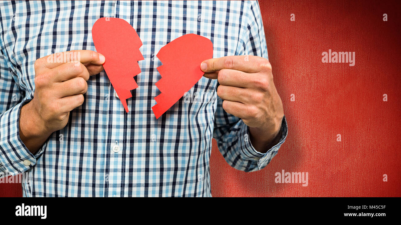 Composite image of sad man with broken heart Stock Photo - Alamy