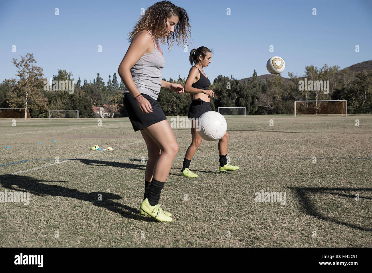 Women of football pitch playing football Stock Photo - Alamy
