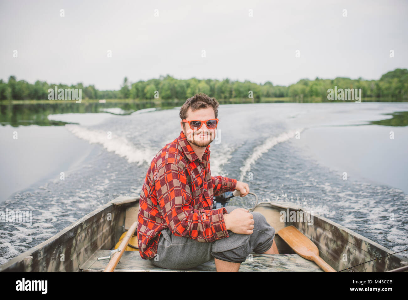 Man in boat hi-res stock photography and images - Alamy