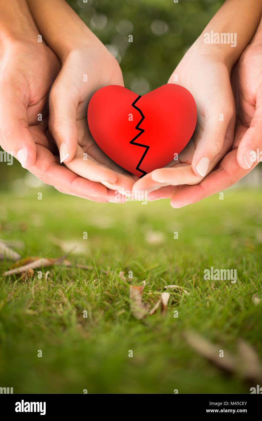 Hand Holding Broken Heart