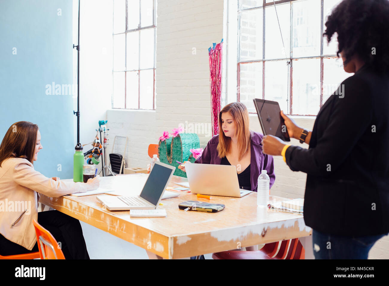 African woman colleagues talking desk hi-res stock photography and ...