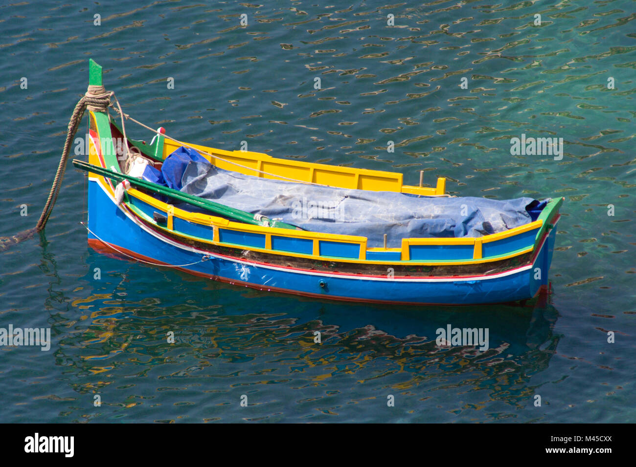One of the famous colorful Luzzu boats you can see in every maltese ...