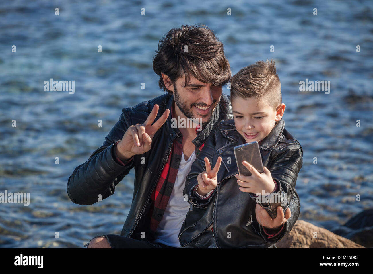 Father and son by the sea hi-res stock photography and images - Alamy