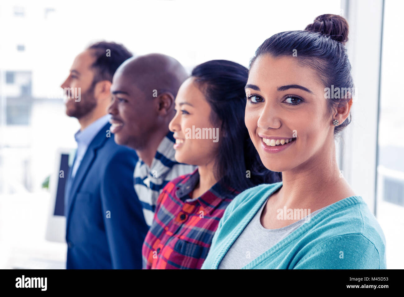 Portrait of attractive businesswoman with colleagues Stock Photo - Alamy