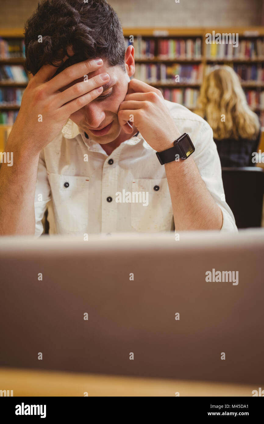 Focused student using his laptop while working Stock Photo - Alamy