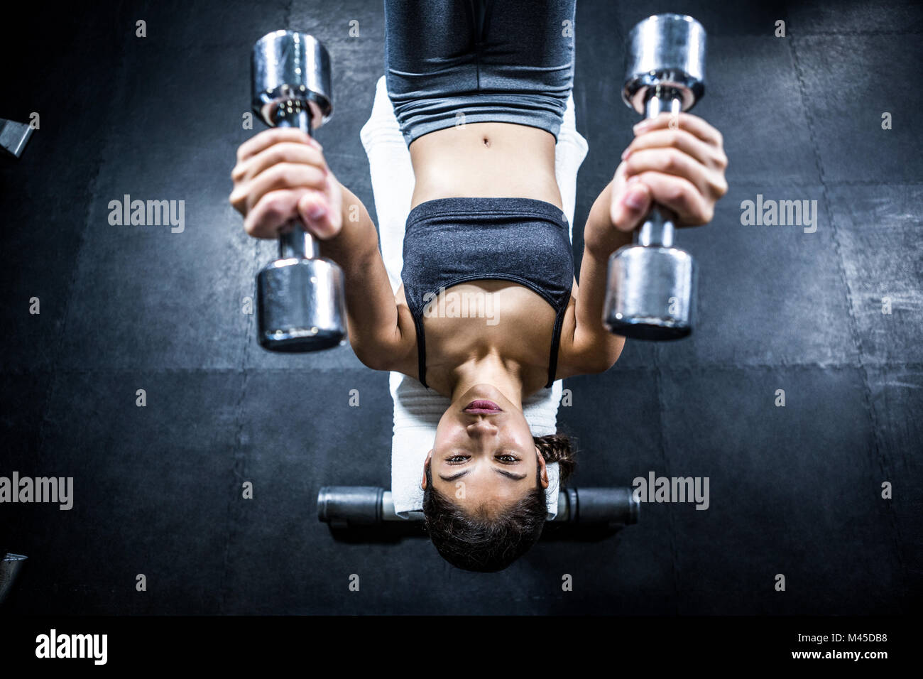 Muscular woman sitting on bench hi-res stock photography and images - Alamy