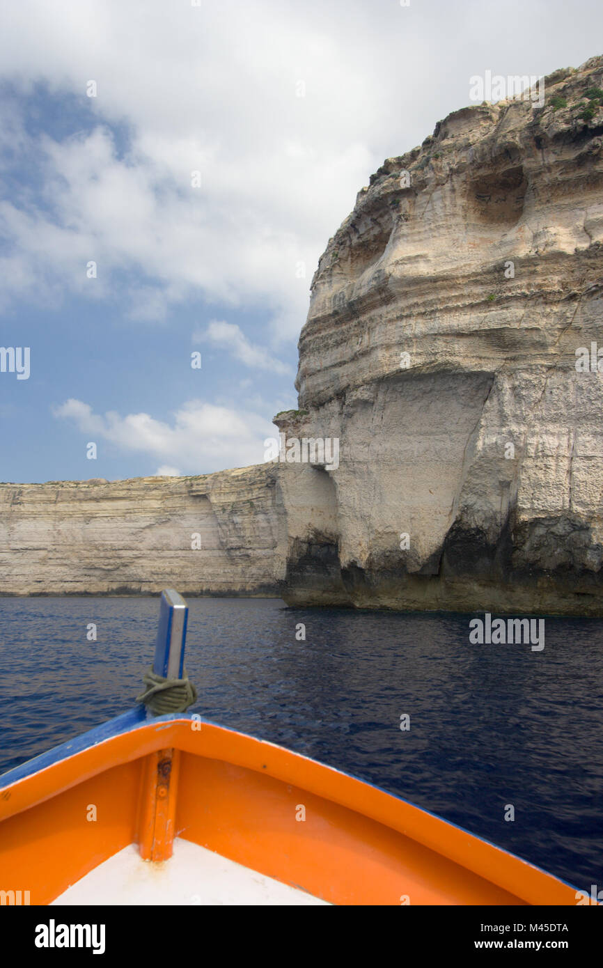 Eyes, nose and mouth form a face in the cliff to the right. Seen from a ...