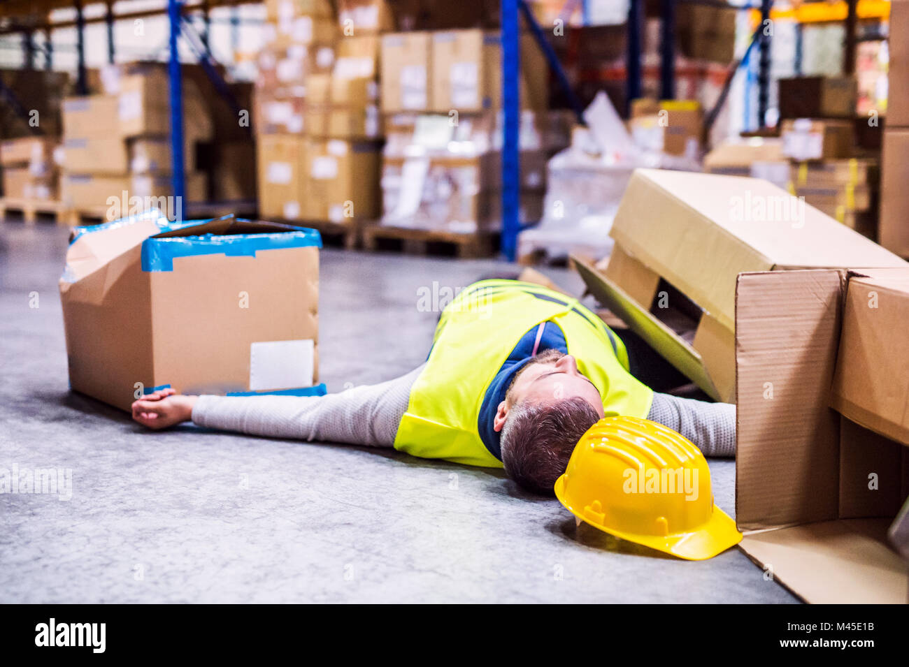 Warehouse worker after an accident in a warehouse Stock Photo - Alamy