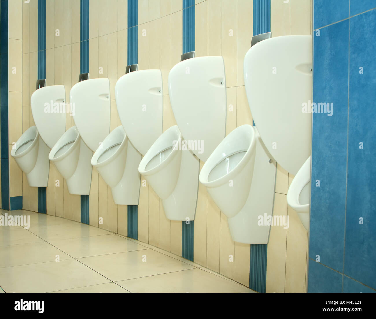 modern restroom interior with urinal row Stock Photo - Alamy
