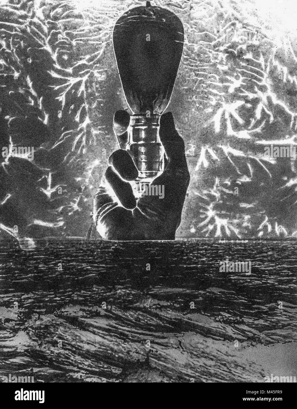 Photo illustration concept of a hand raising up from a body of water ...