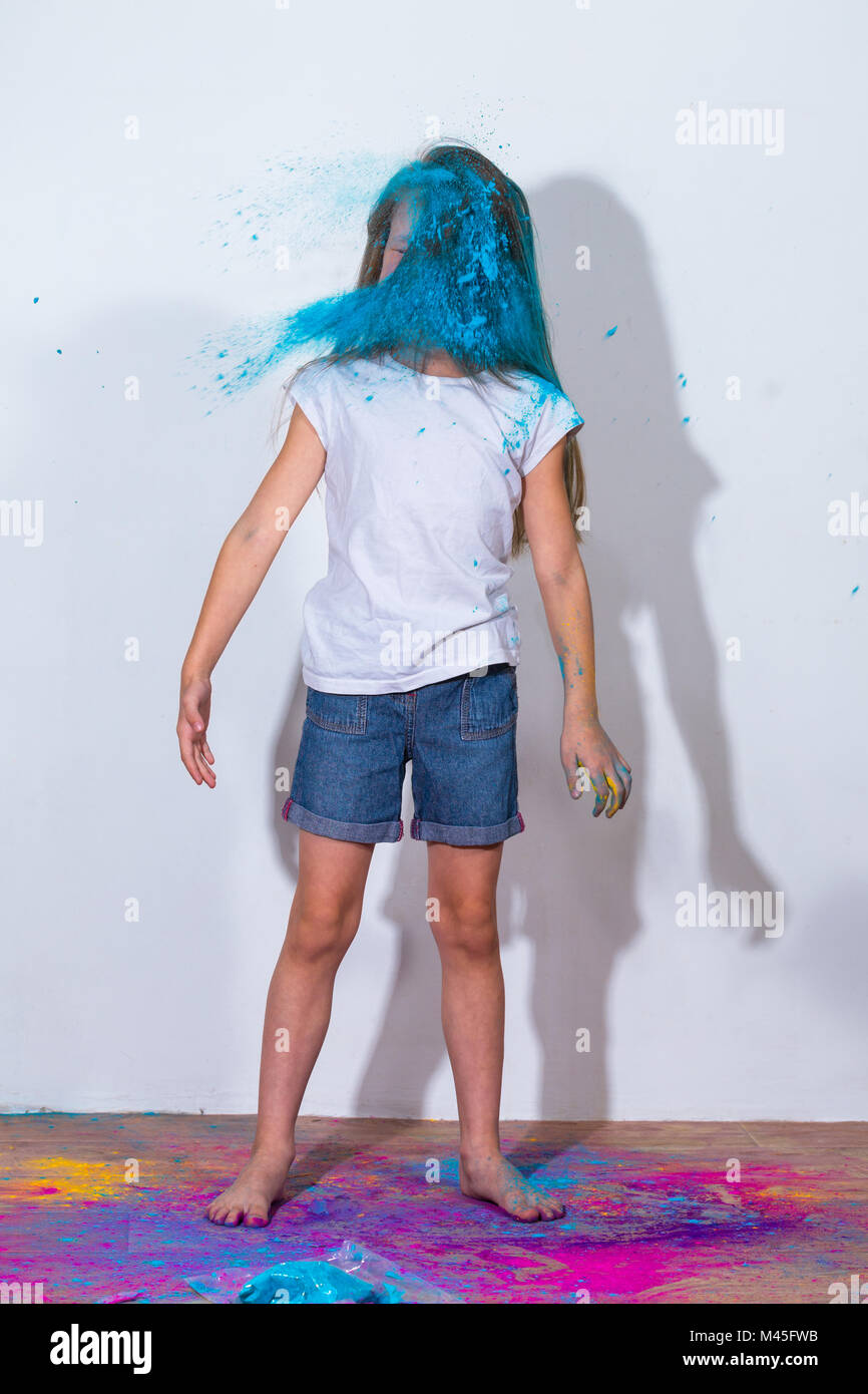 Blue paint holi on face Stock Photo - Alamy
