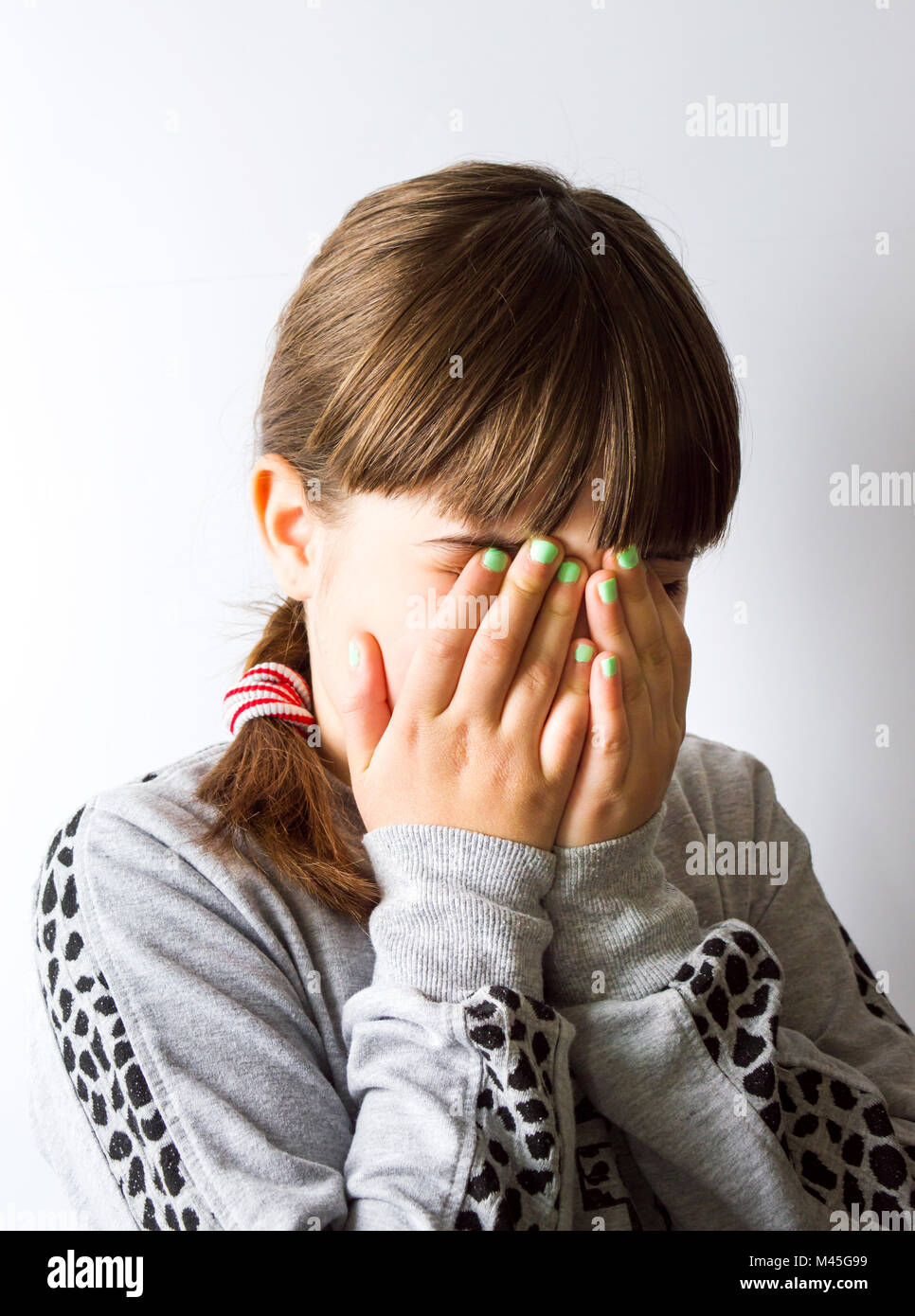 Portrait of a shy little girl close up Stock Photo - Alamy