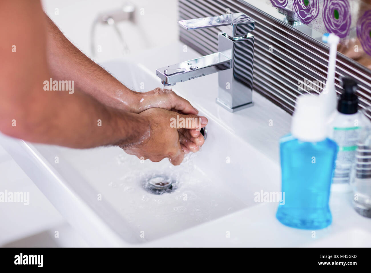 Close up of washing hands under running water Stock Photo - Alamy