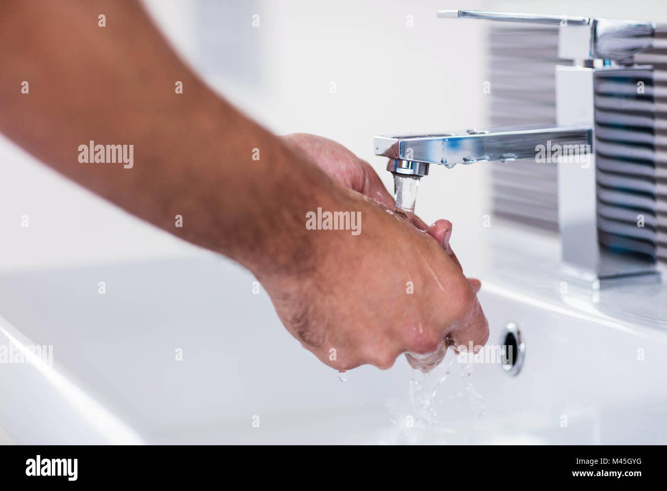 Close up of washing hands under running water Stock Photo - Alamy