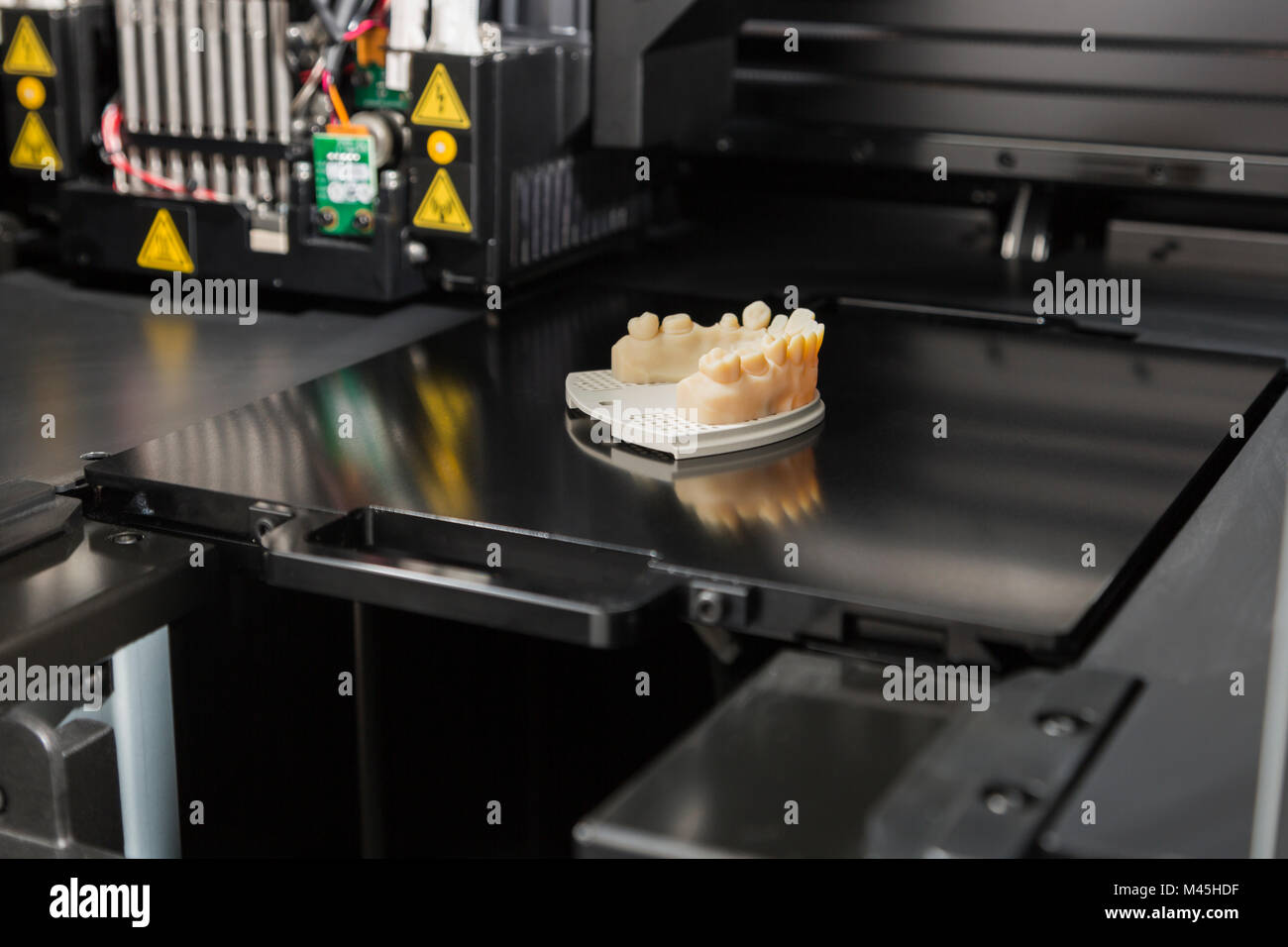 Open 3D Printer With Finished 3D Printed Dental Implant Bridge Stock ...