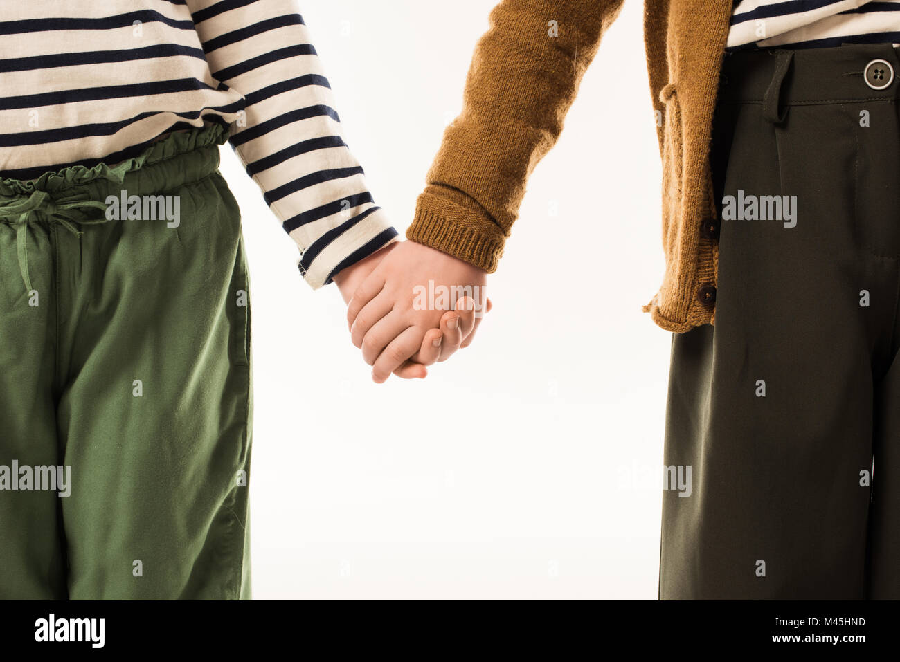 cropped shot of little kids holding hands isolated on white Stock Photo ...