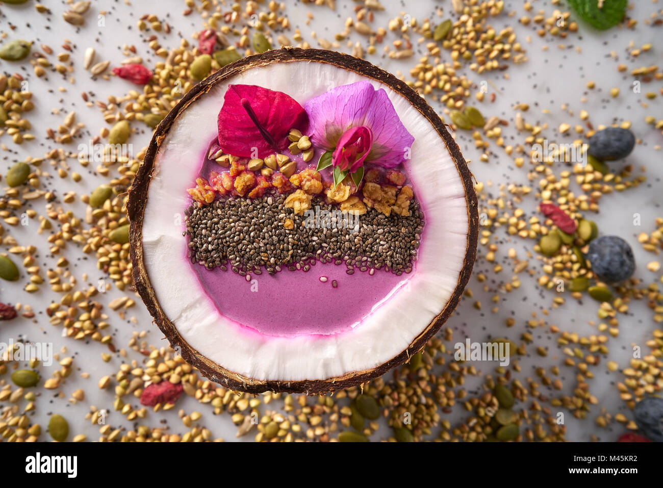 Acai bowl smoothie inside coconut chia granola blueberry and pitaya ...