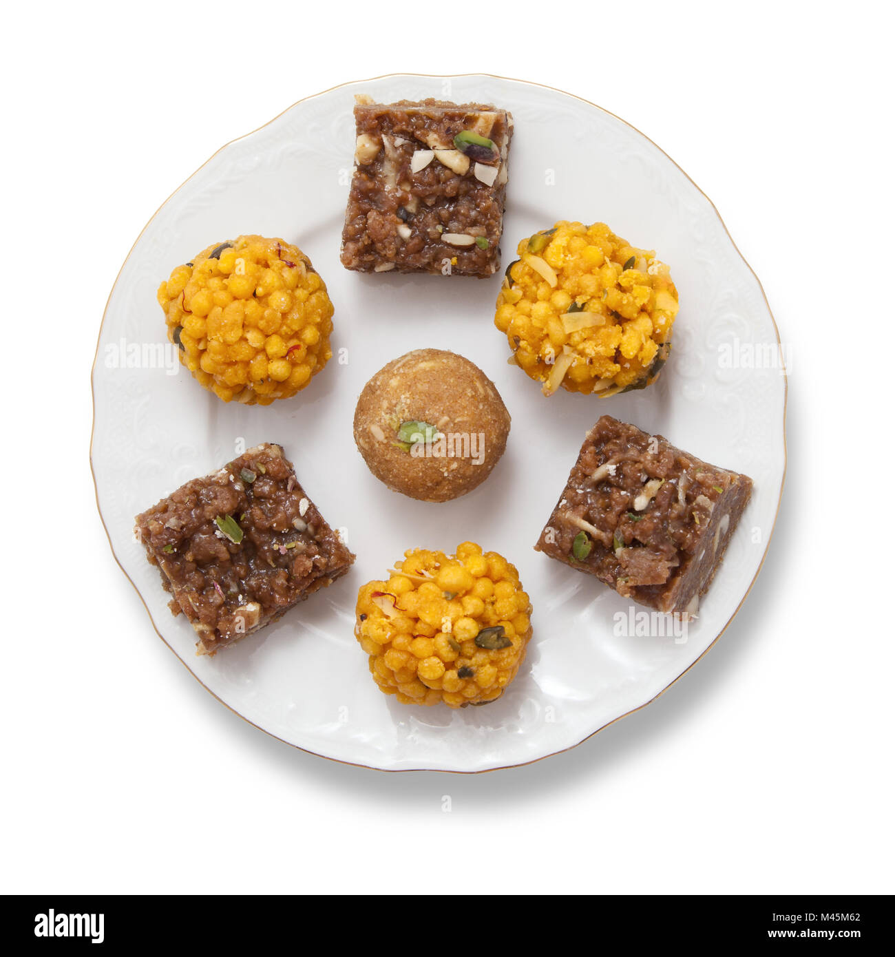 Indian sweets on a plate Stock Photo - Alamy