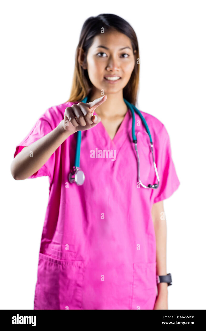 Asian nurse with stethoscope pointing in front of her Stock Photo - Alamy